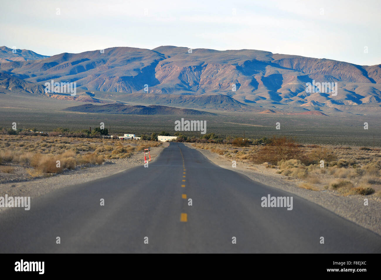 Empty desert road through Death Valley National Park Stock Photo - Alamy