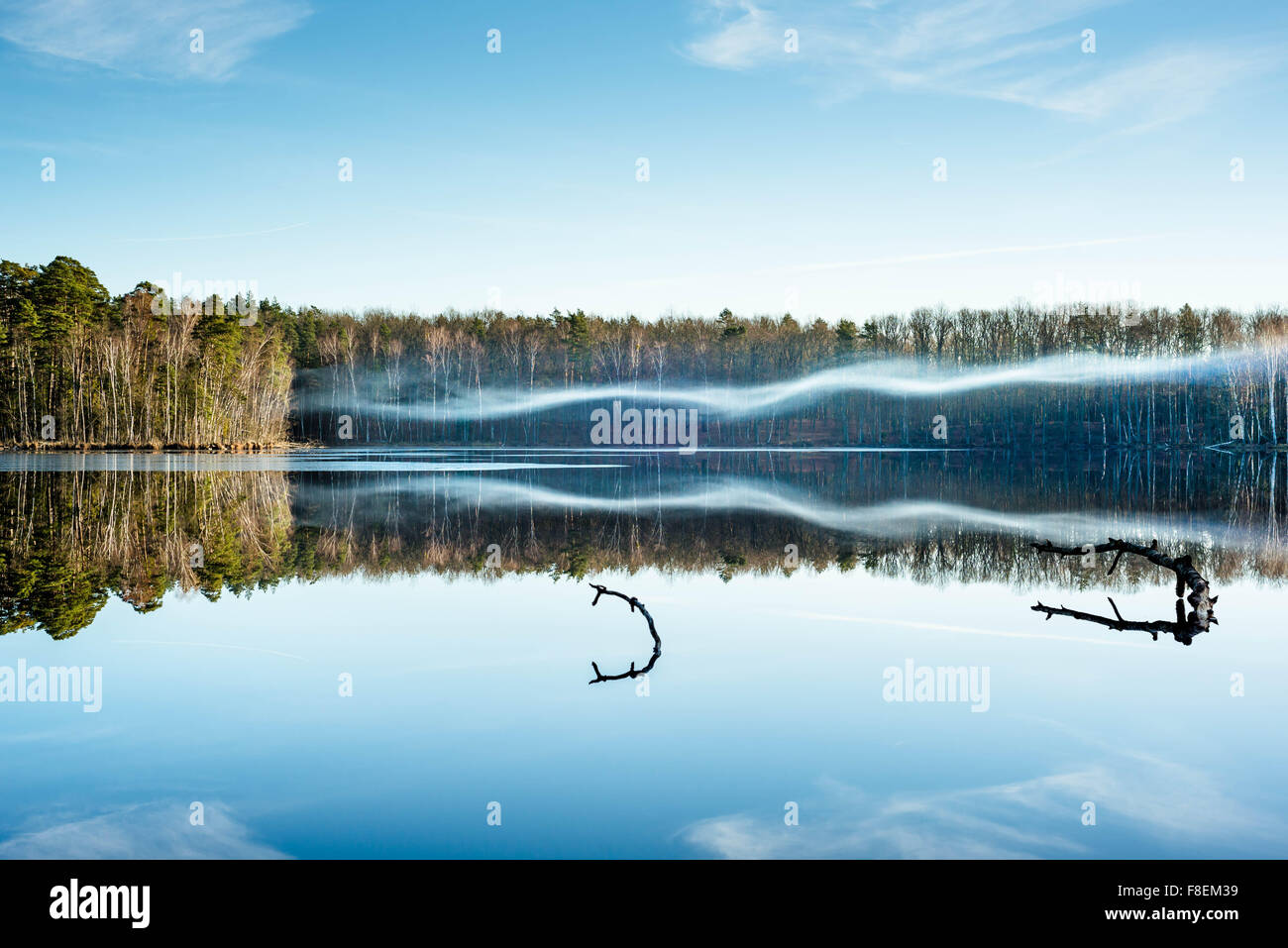A mystic fog over the lake surface Stock Photo - Alamy