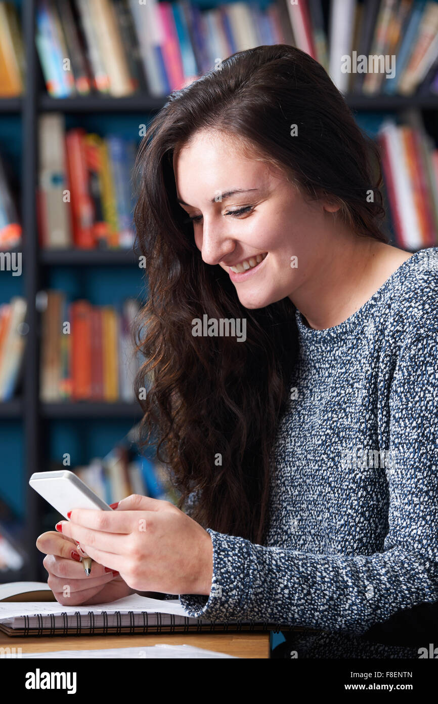 Female Teenage Pupil Texting In Classroom Stock Photo - Alamy