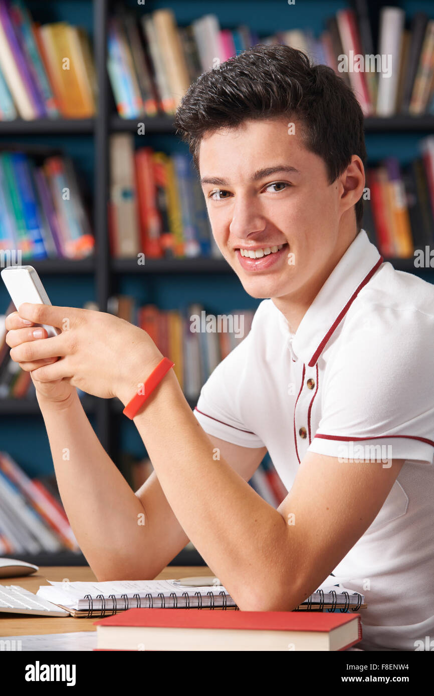 Male Teenage Pupil Texting In Classroom Stock Photo - Alamy