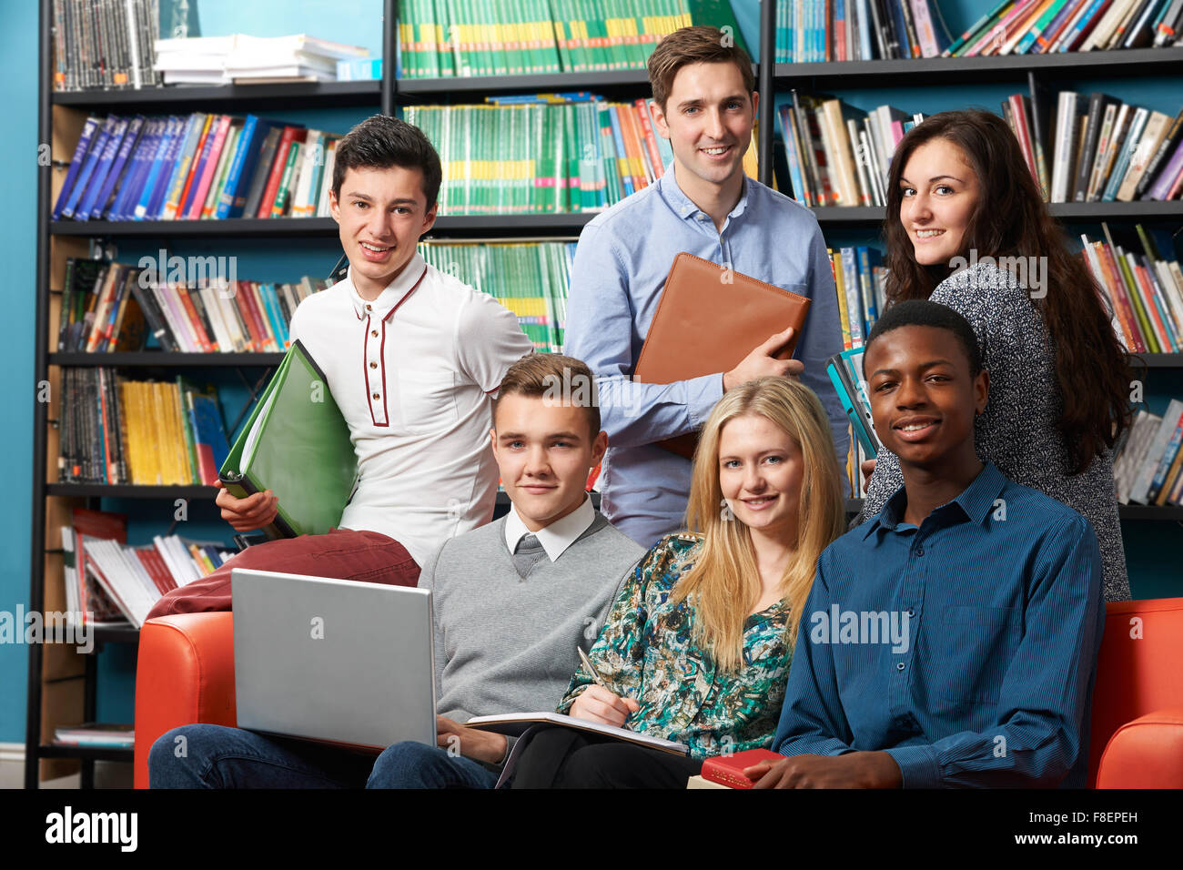 Portrait Of Teacher With Students In Library Stock Photo - Alamy