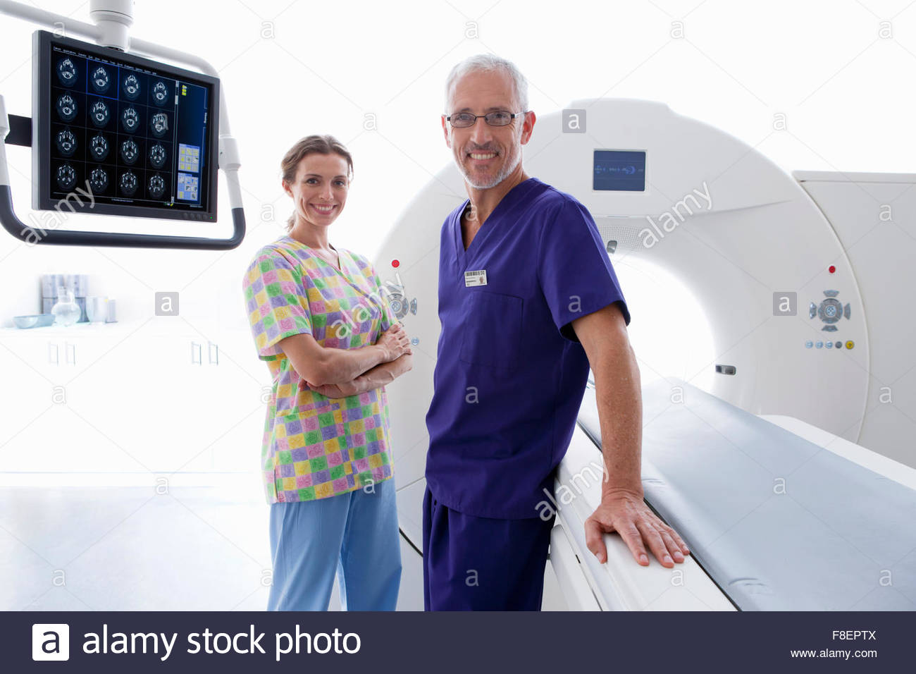Doctor With Computer Looking At Camera Stock Photos & Doctor With ...