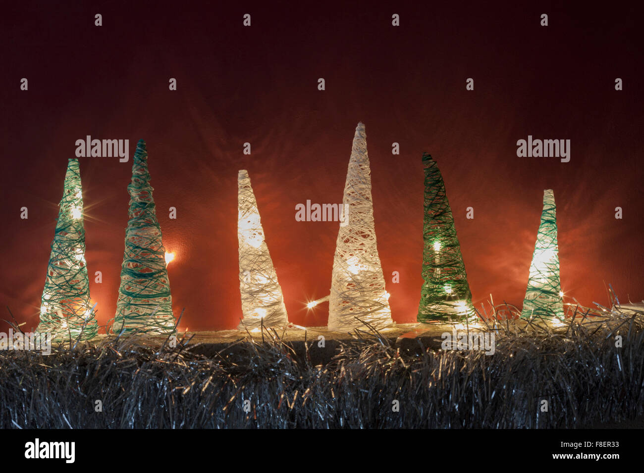 a horizontal frontal view of a decorated fireplace with illuminated ...