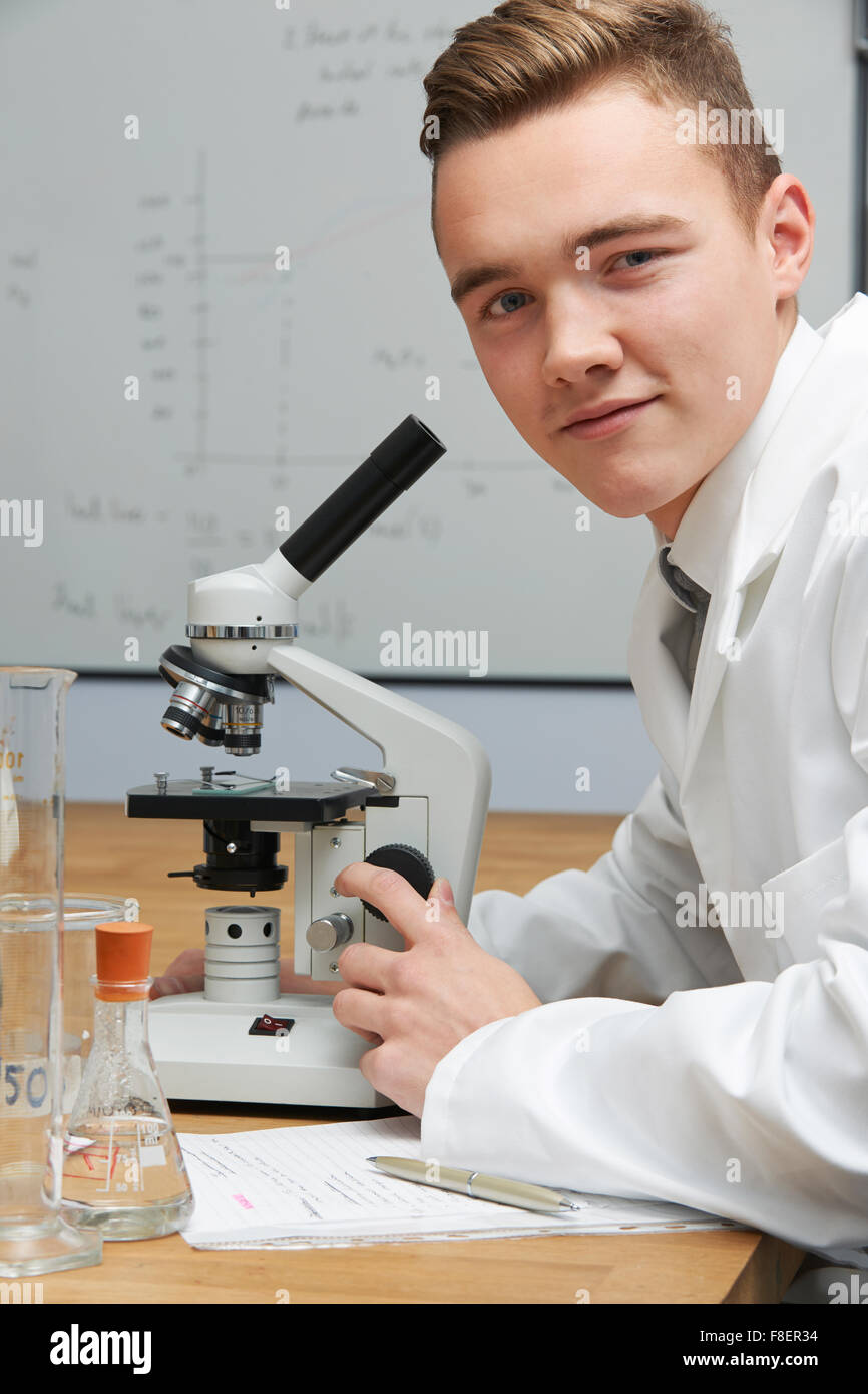 Teen boy using microscope hi-res stock photography and images - Alamy