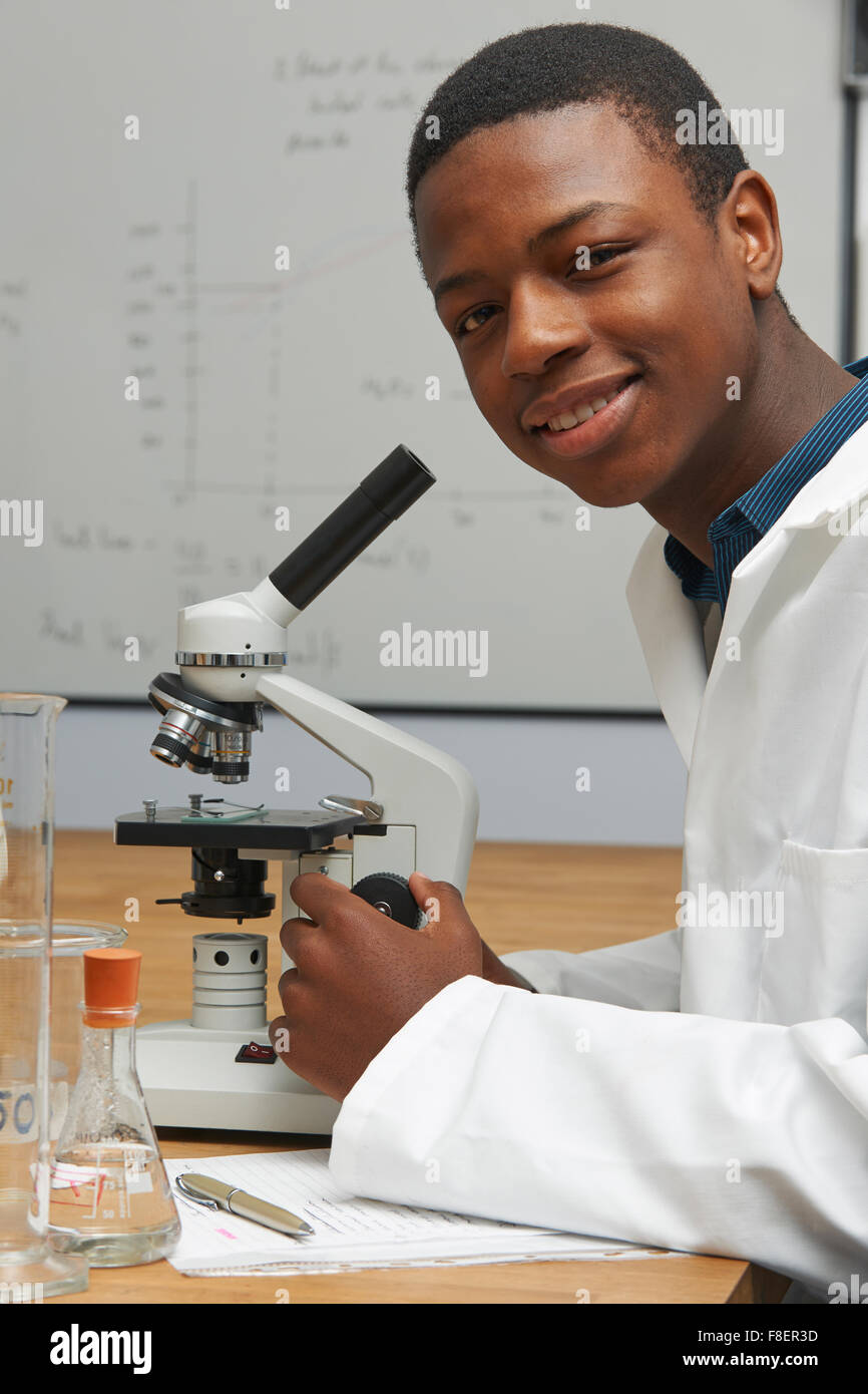 Portrait Of Pupil Using Microscope In Science Lesson Stock Photo - Alamy