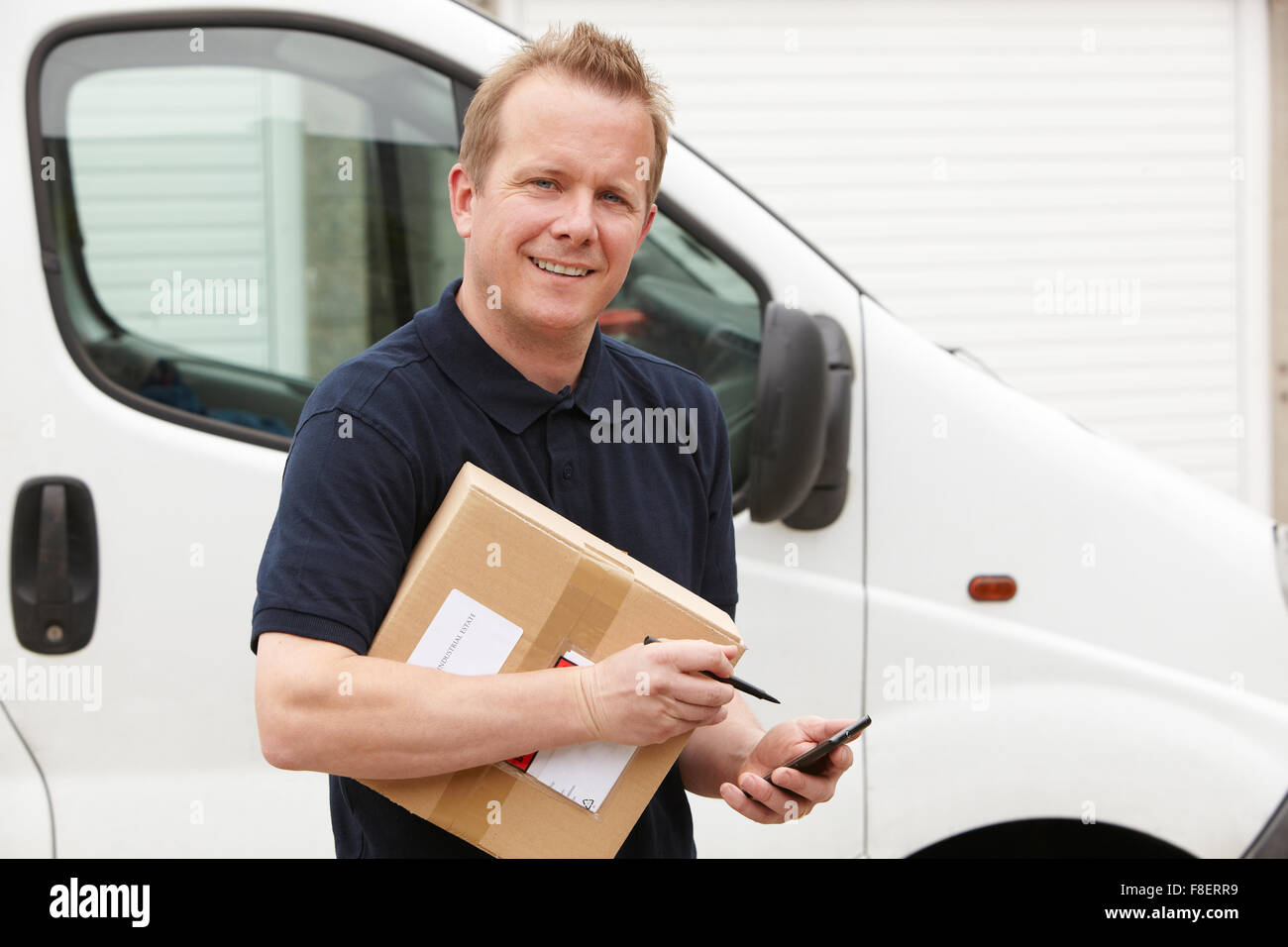 Courier Delivering Package Requiring Signature Stock Photo - Alamy