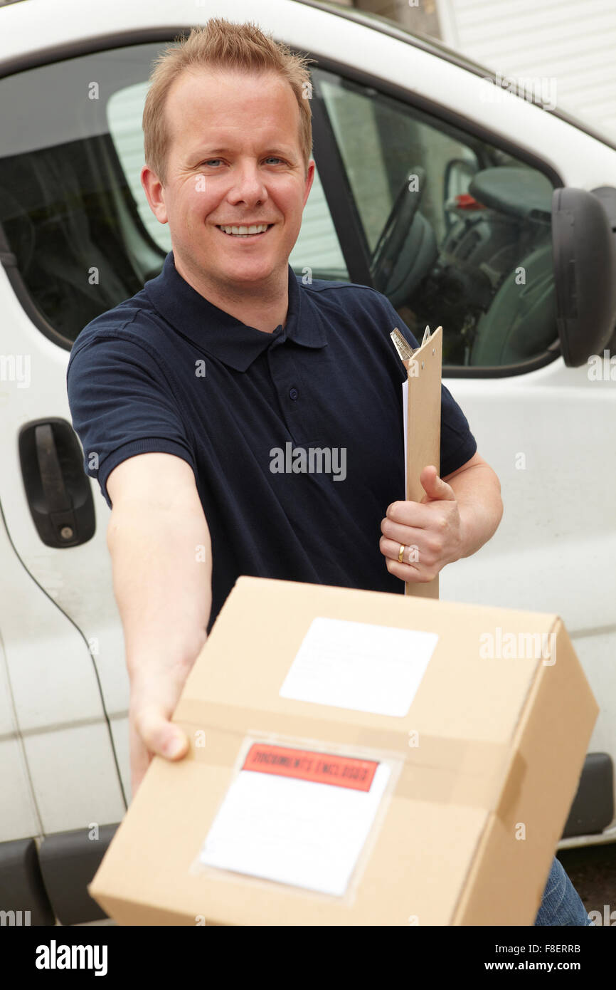Courier Delivering Package Requiring Signature Stock Photo - Alamy