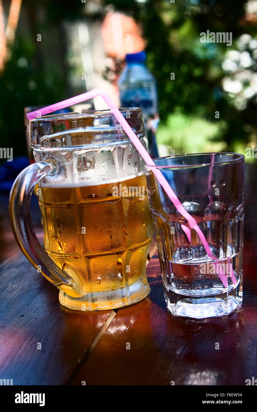Still from a mug of beer and glasses of water Stock Photo - Alamy