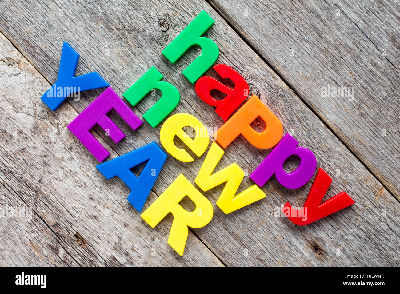 Happy New Year written in a colorful plastic letters Stock Photo - Alamy