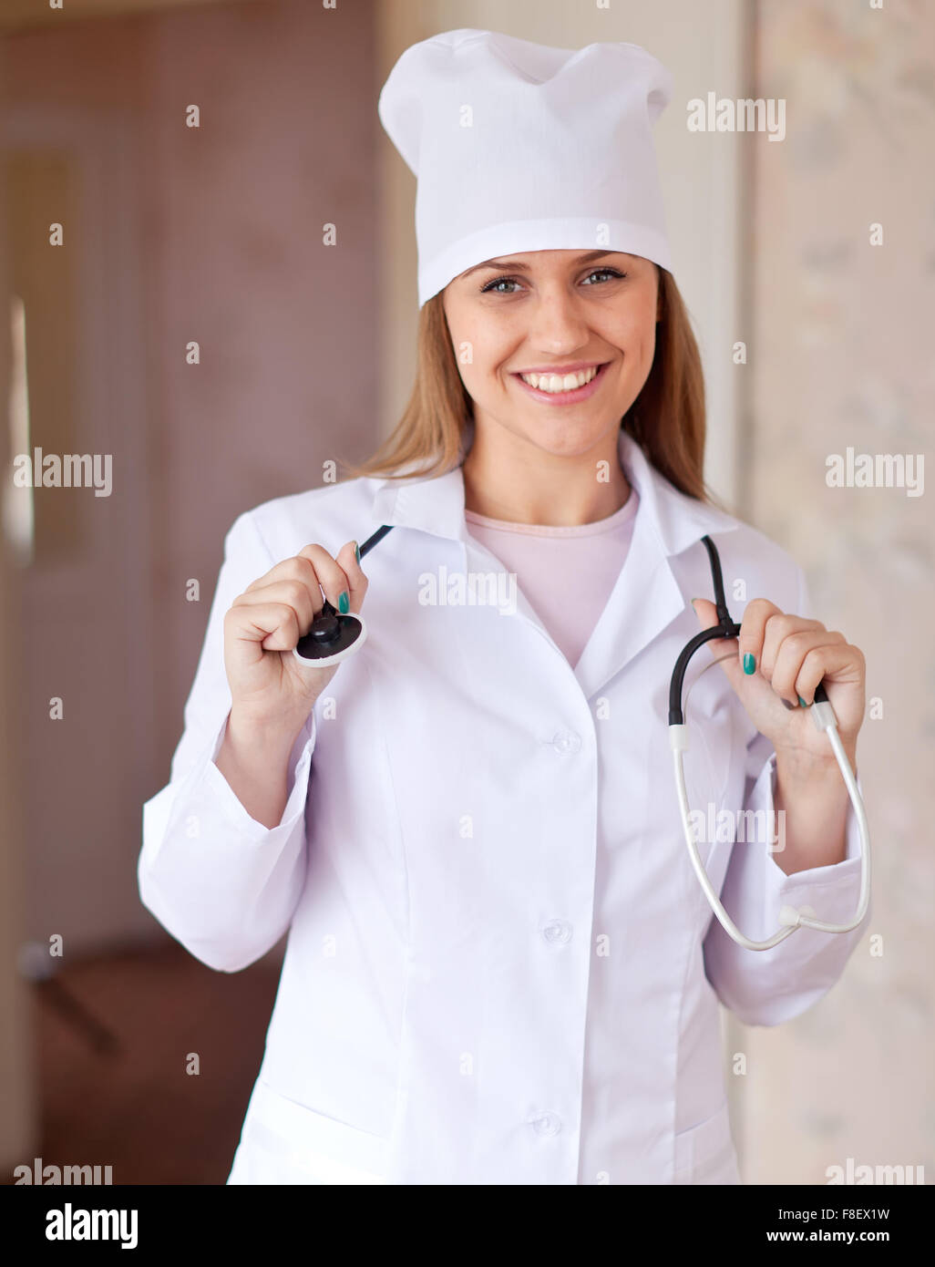 Portrait of friendly doctor in clinic interior Stock Photo - Alamy