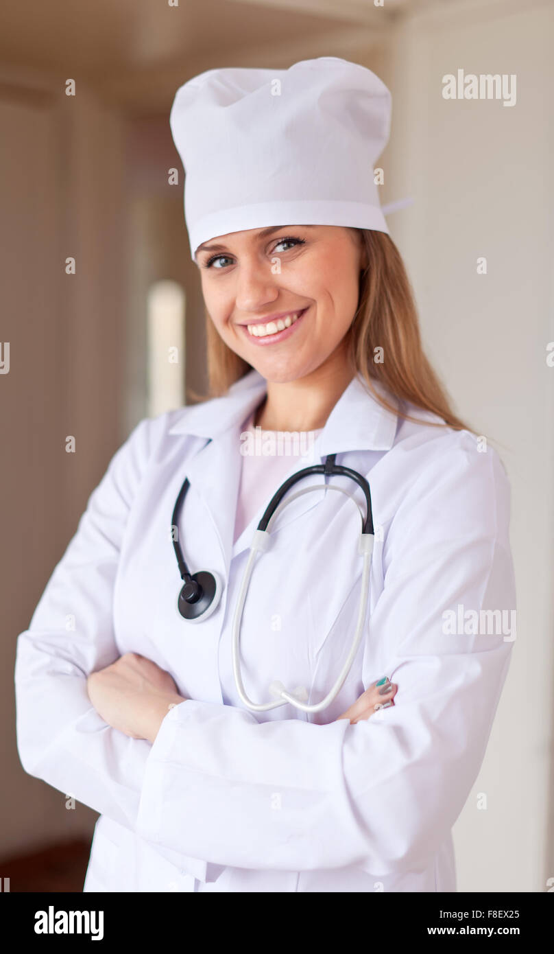 Portrait of friendly doctor in clinic interior Stock Photo - Alamy