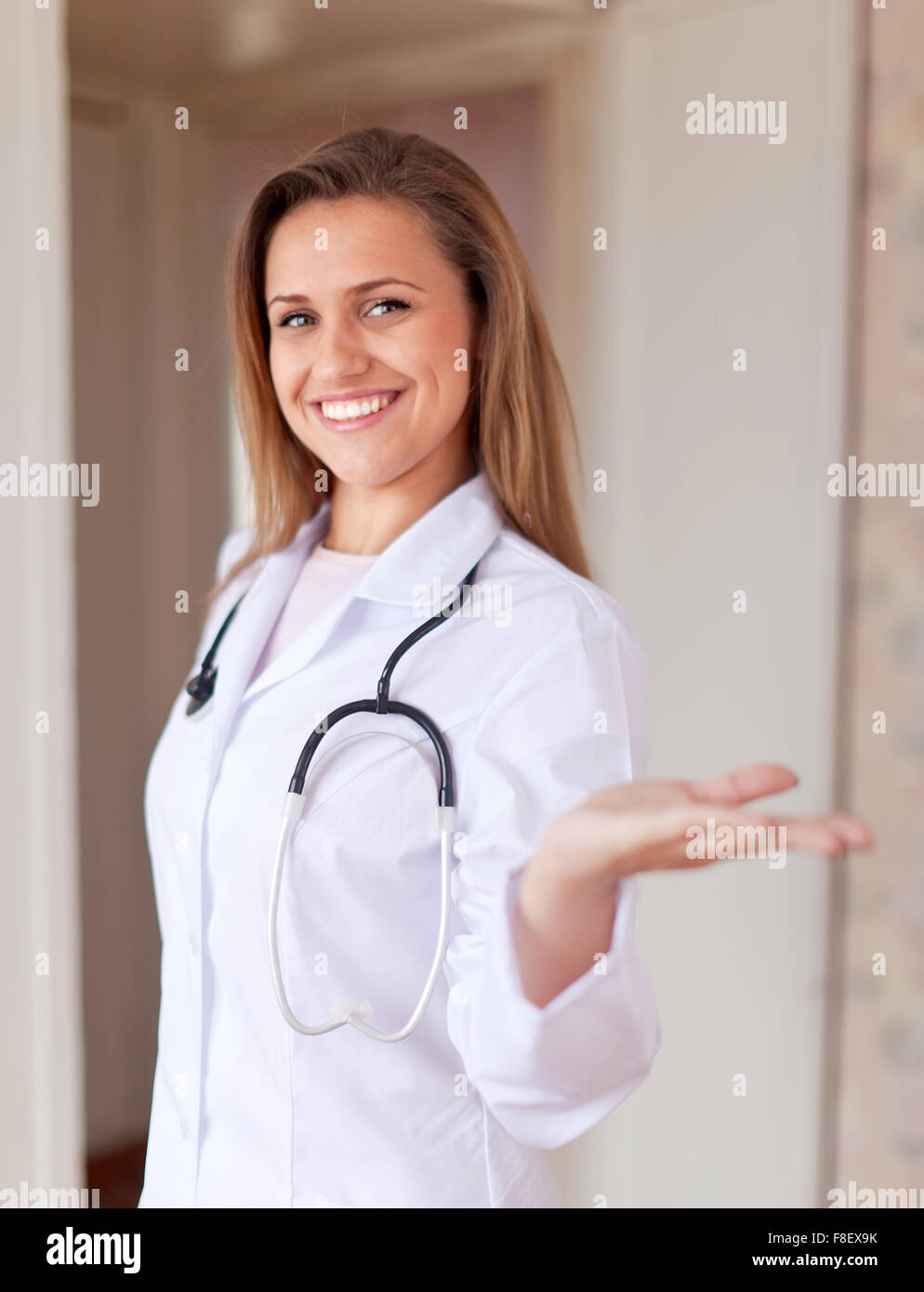 Portrait of friendly doctor in clinic interior Stock Photo - Alamy