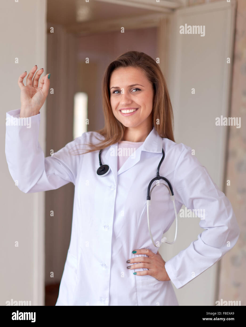 friendly doctor shows OK sign in clinic interior Stock Photo - Alamy