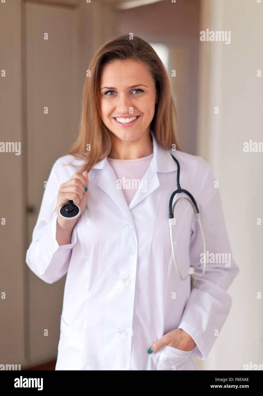 Portrait of friendly doctor in clinic interior Stock Photo - Alamy