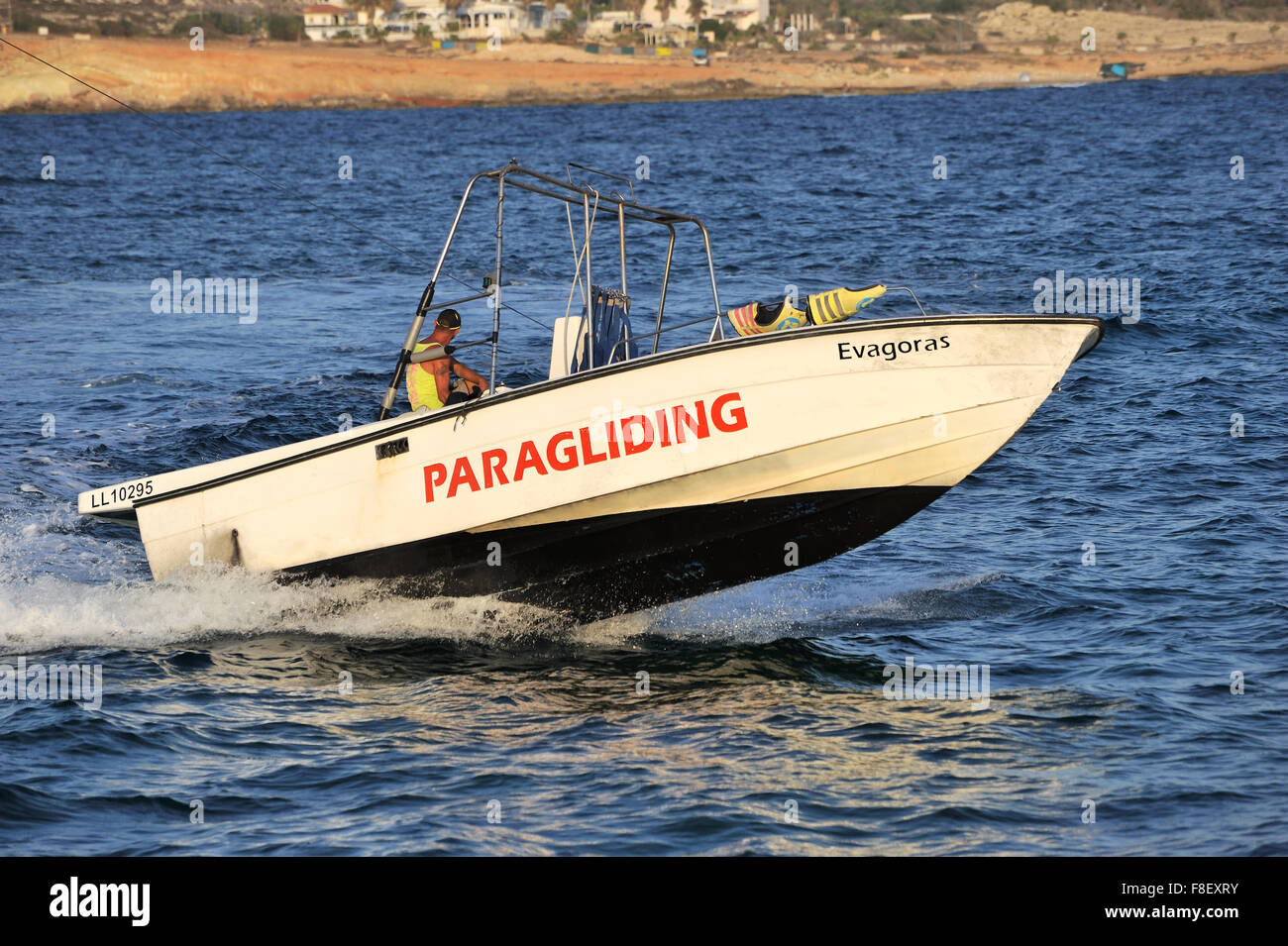 Boat with Captain floating on waves, amusement a parachute flight, Ayia ...