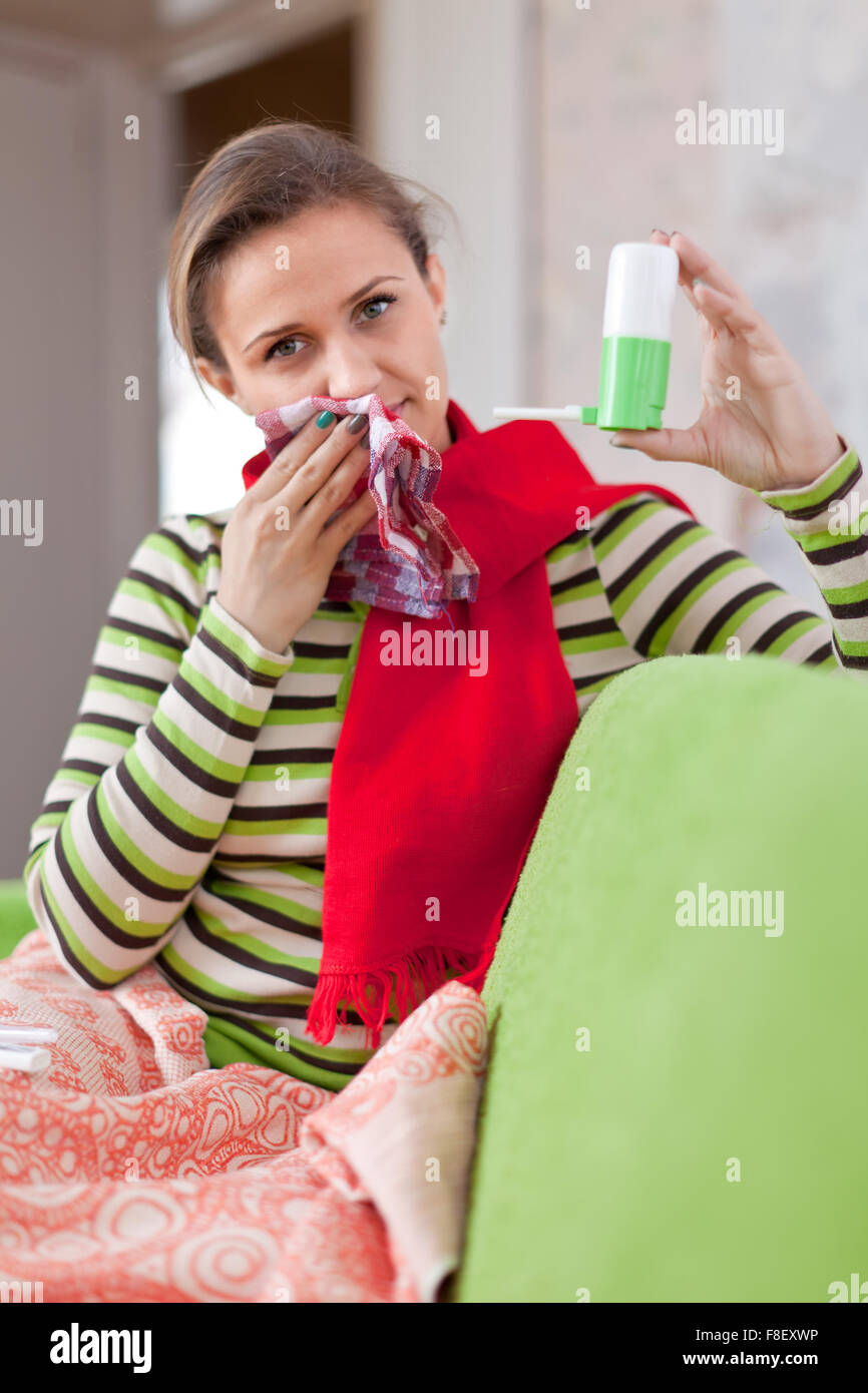 illness woman in warm scarf with spray Stock Photo - Alamy