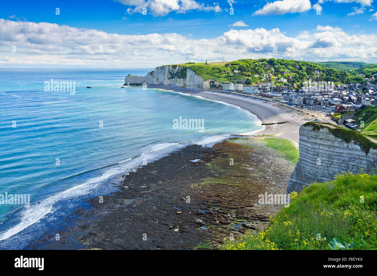 Etretat village and its bay beach, aerial view from cliff. Normandy ...