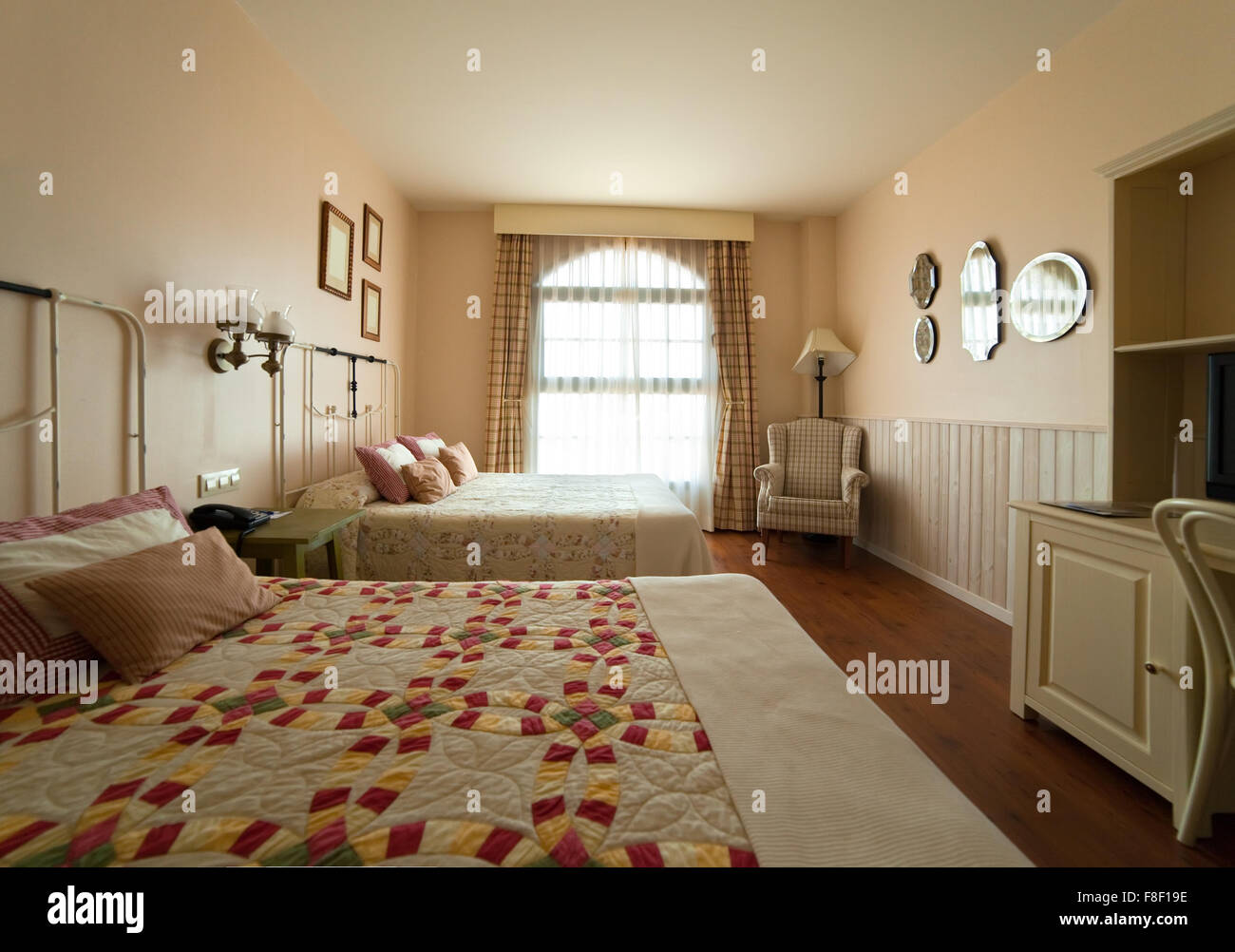 interior of bedroom with two double bed Stock Photo - Alamy