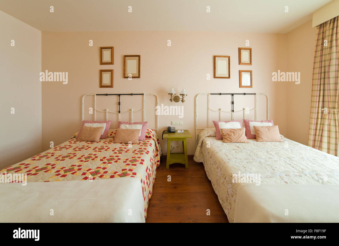 interior of bedroom with two double bed Stock Photo - Alamy