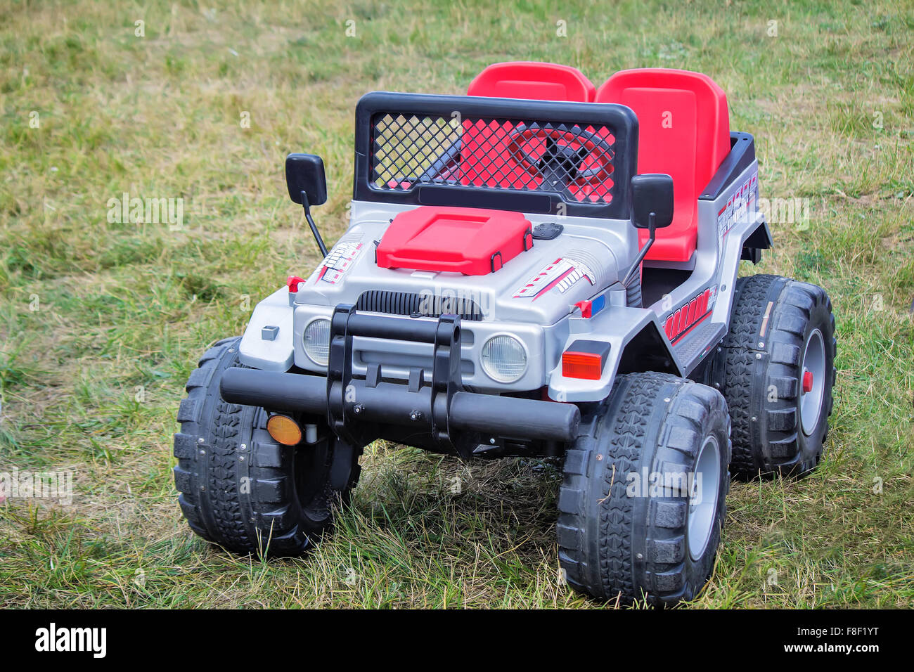 On the lawn stands double baby car for children on a wide steady wheel ...