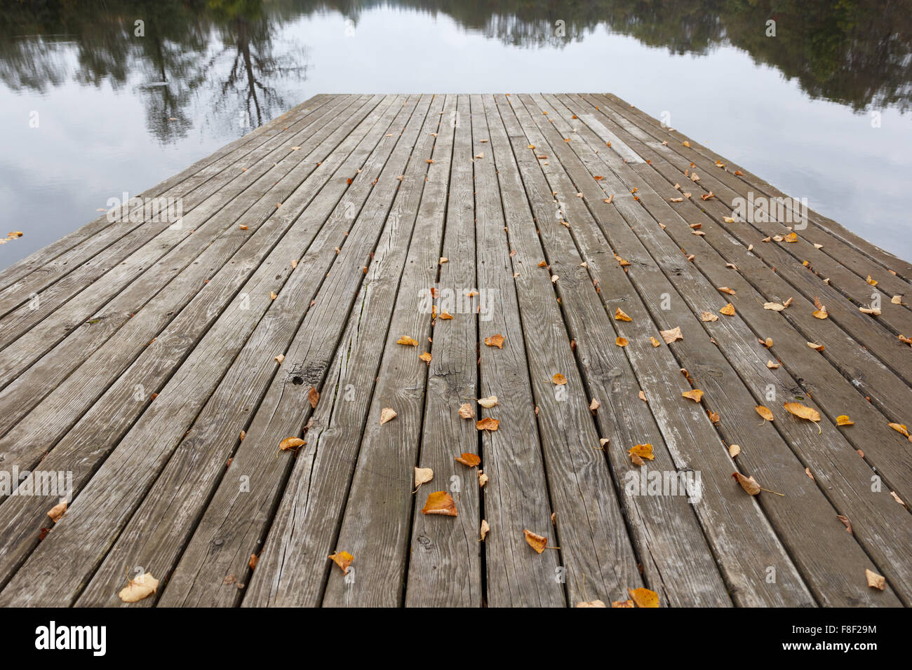 Wood planks above water Stock Photo - Alamy