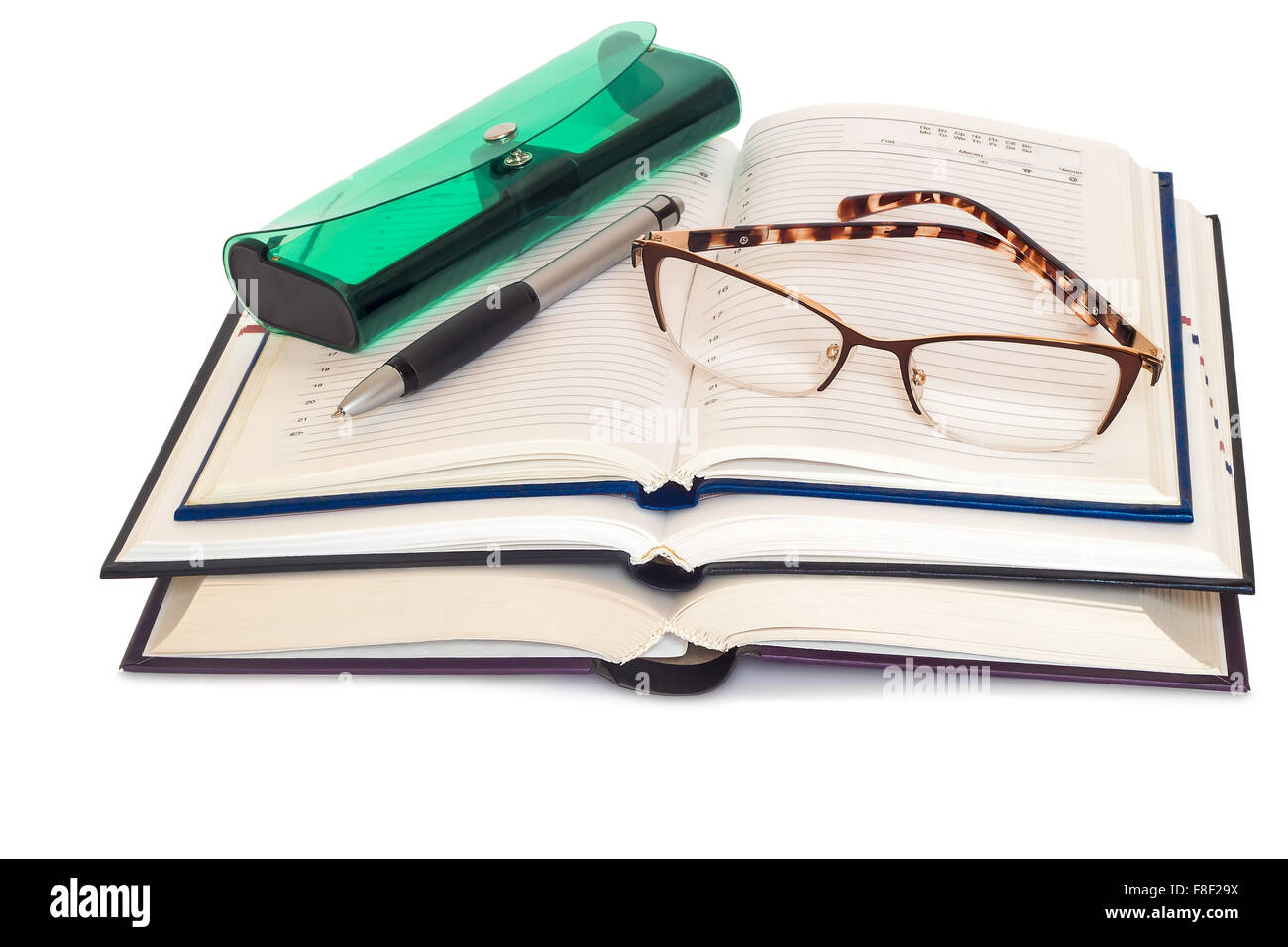 On a white background presented two books and a notebook. They are ...