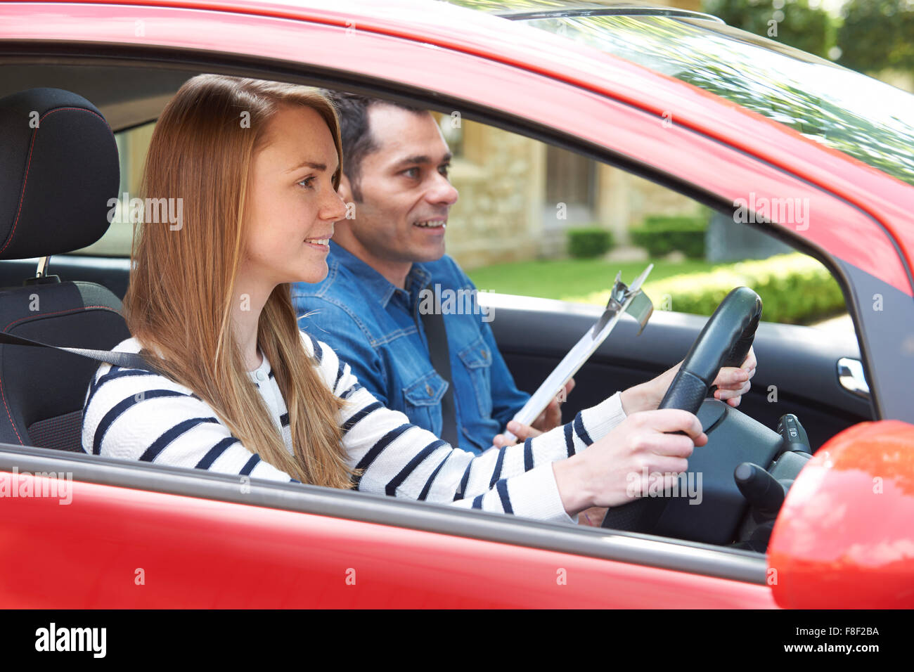 Woman Having Driving Lesson With Instructor Stock Photo - Alamy