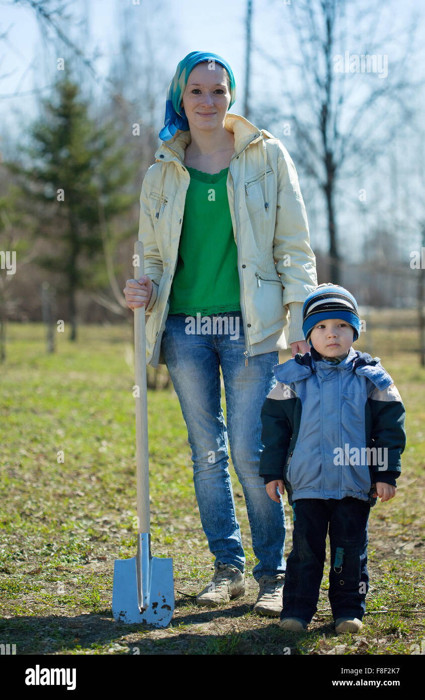 young woman with her son working with spade outdoor Stock Photo - Alamy