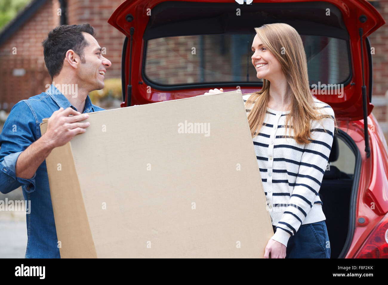 Woman loading car trunk hi-res stock photography and images - Alamy