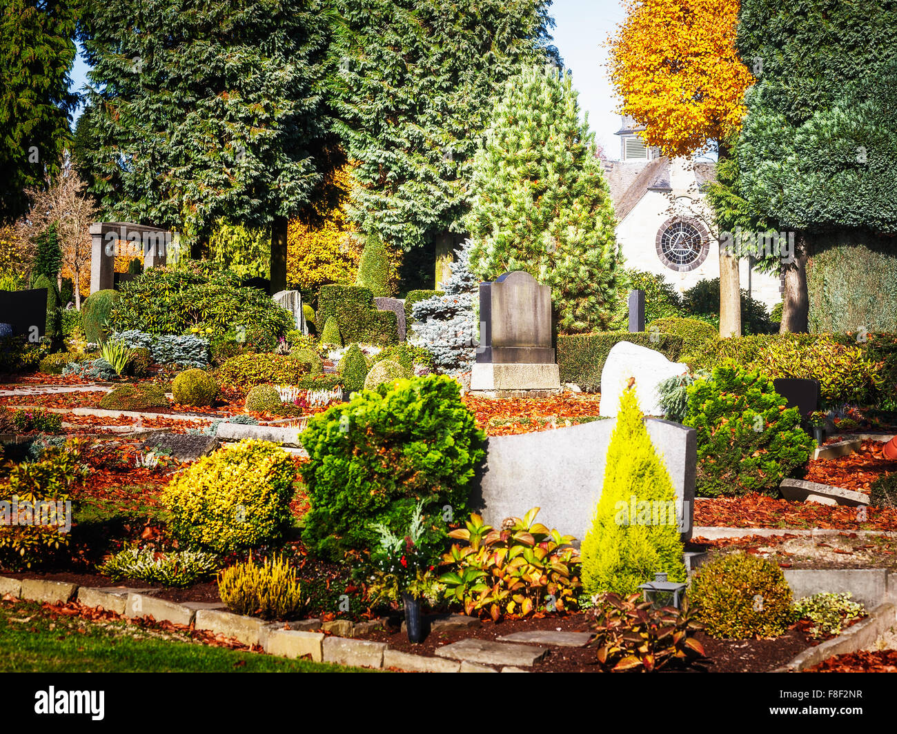 Old german cemetery with white chapel. Autumn sunny day Stock Photo - Alamy