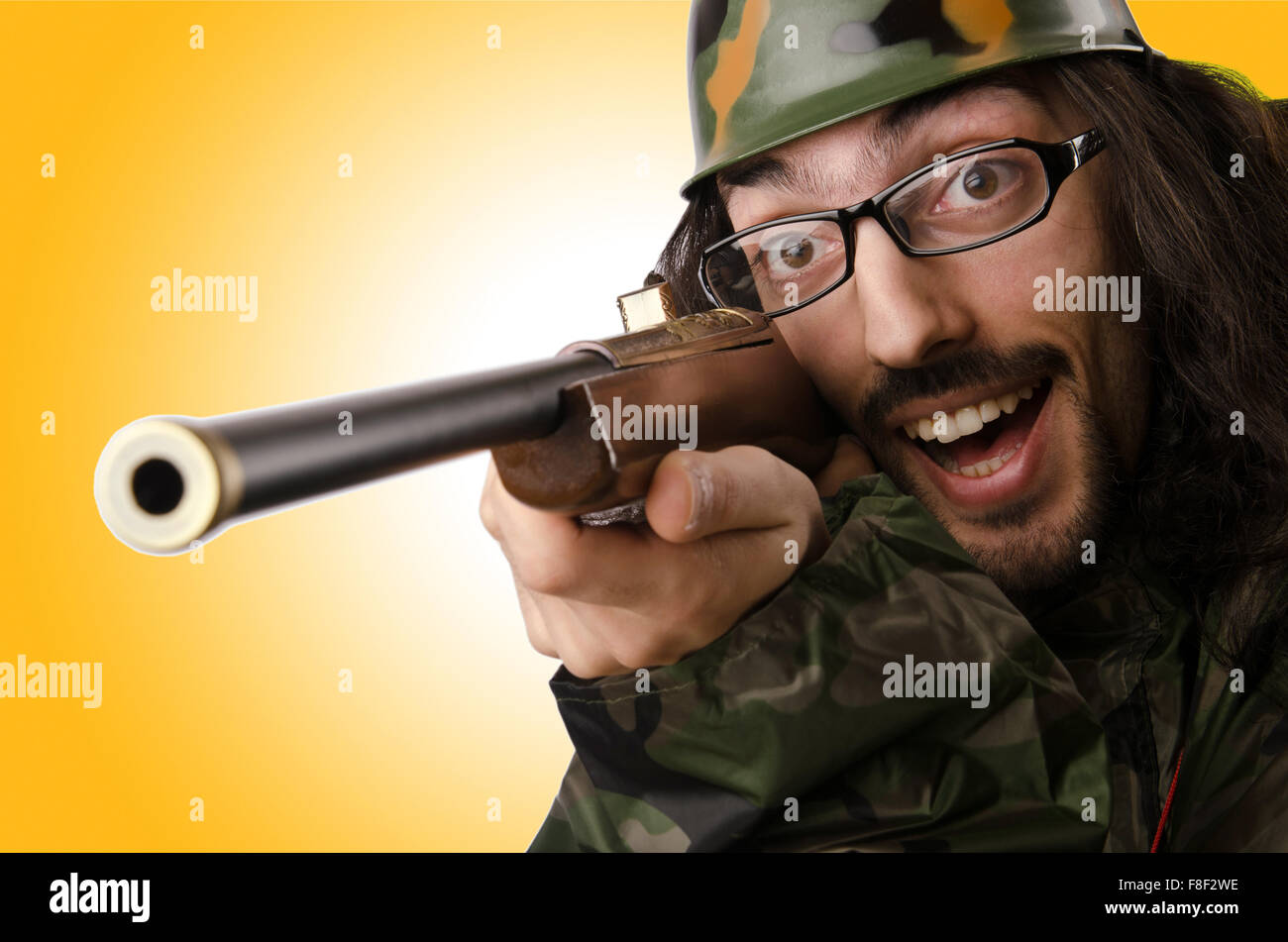Funny soldier in humour concept Stock Photo - Alamy