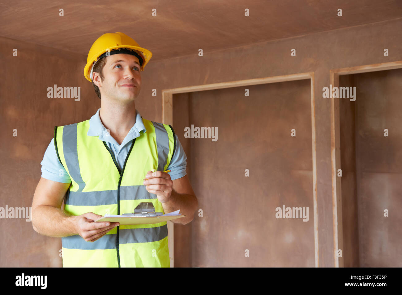 Building Inspector Looking At New Property Stock Photo - Alamy