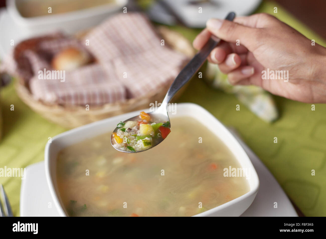 Woman eating vegetable soup hi-res stock photography and images - Alamy