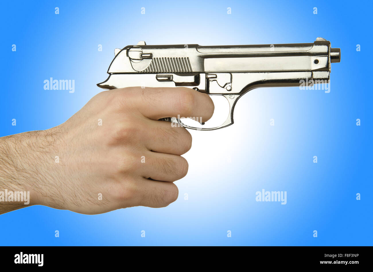 Gun in the hand on white Stock Photo - Alamy