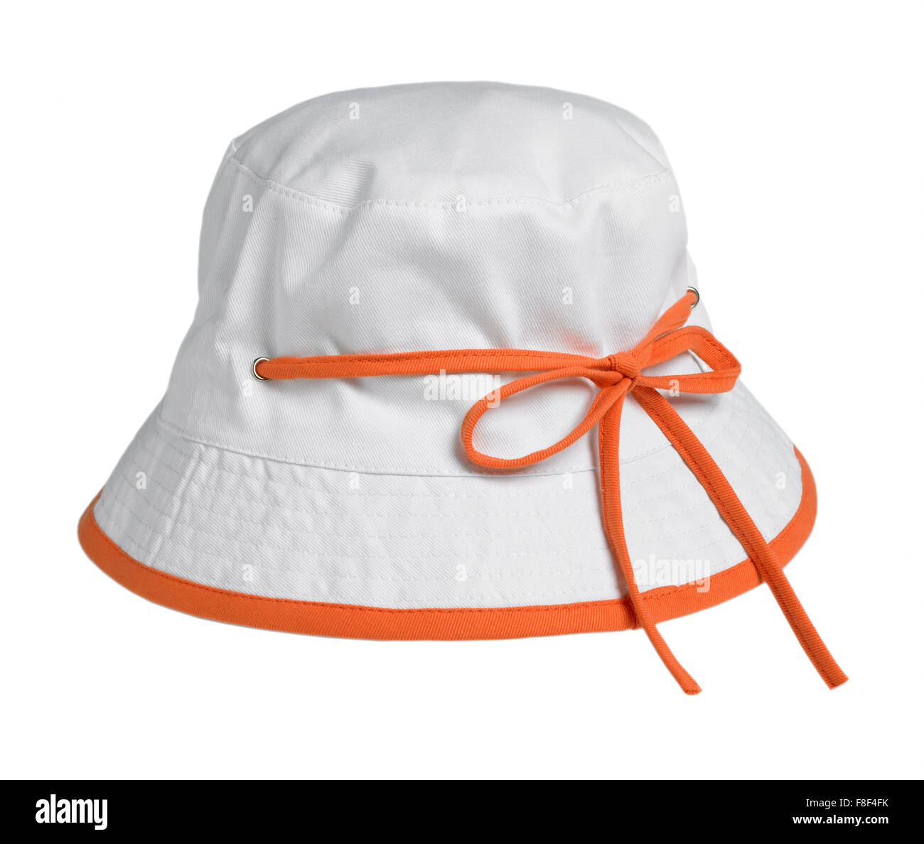 Small white cap for child with an orange bow isolated on white ...