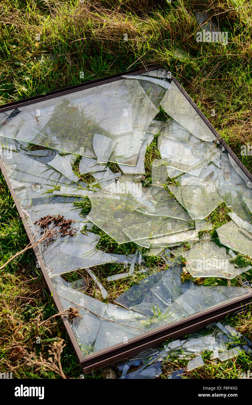 Dumped broken glass window Stock Photo - Alamy