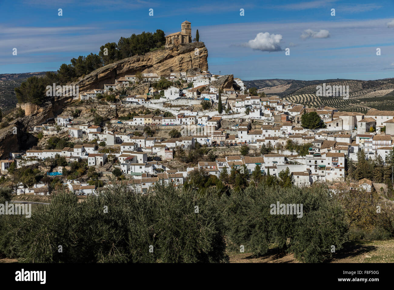 Spanish village of Montefrio with a church on top of the mountain and ...