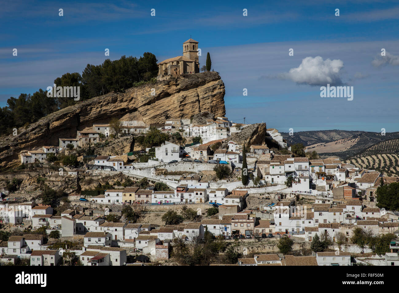Montefrio village in Spain with a church on top of the mountain and ...