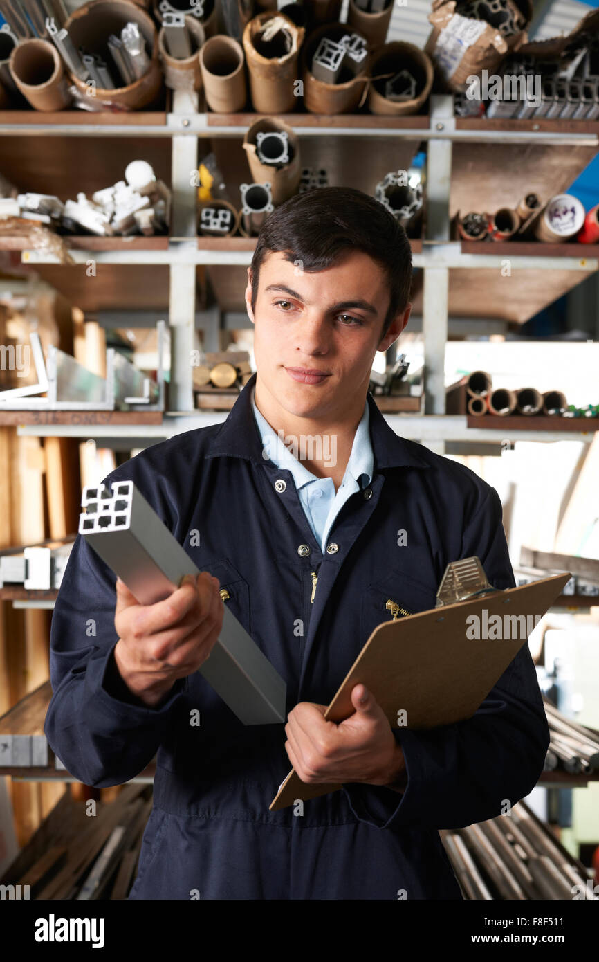 Factory Worker In Store Room With Components Stock Photo - Alamy