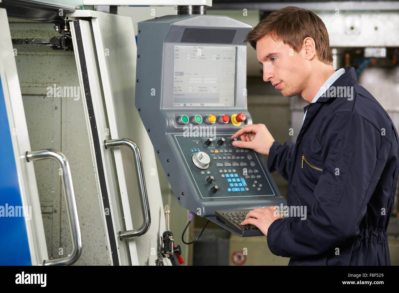 Engineer Operating Computerized Cutting Machine Stock Photo - Alamy