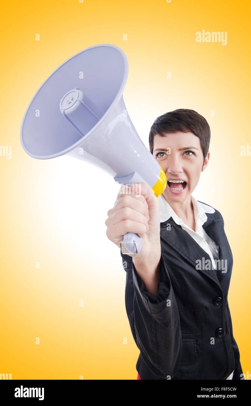 Young business lady screaming to loudspeaker Stock Photo - Alamy