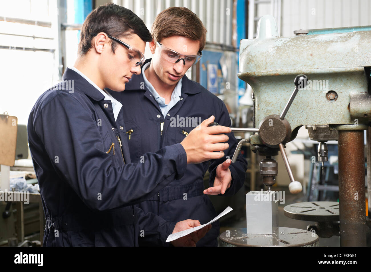 Using equipment hi-res stock photography and images - Alamy