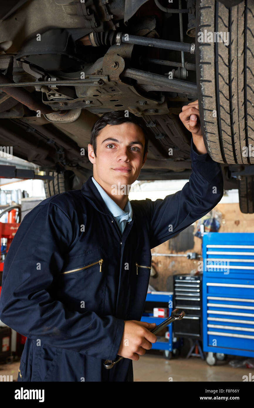 Trainee Mechanic Working Under Car Stock Photo - Alamy
