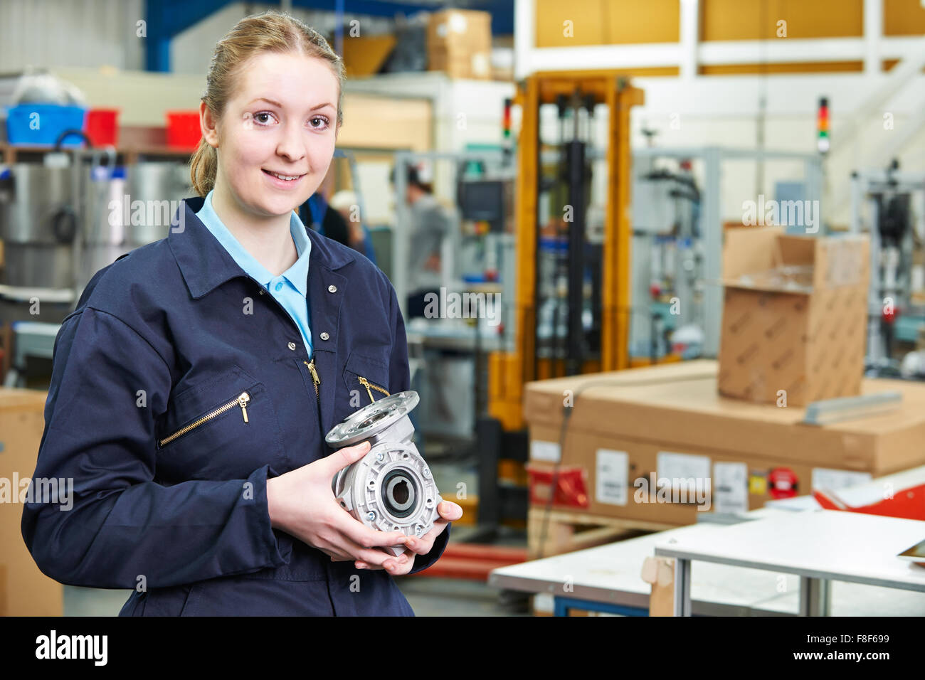 Female Apprentice Engineer industry Component Stock Photo - Alamy
