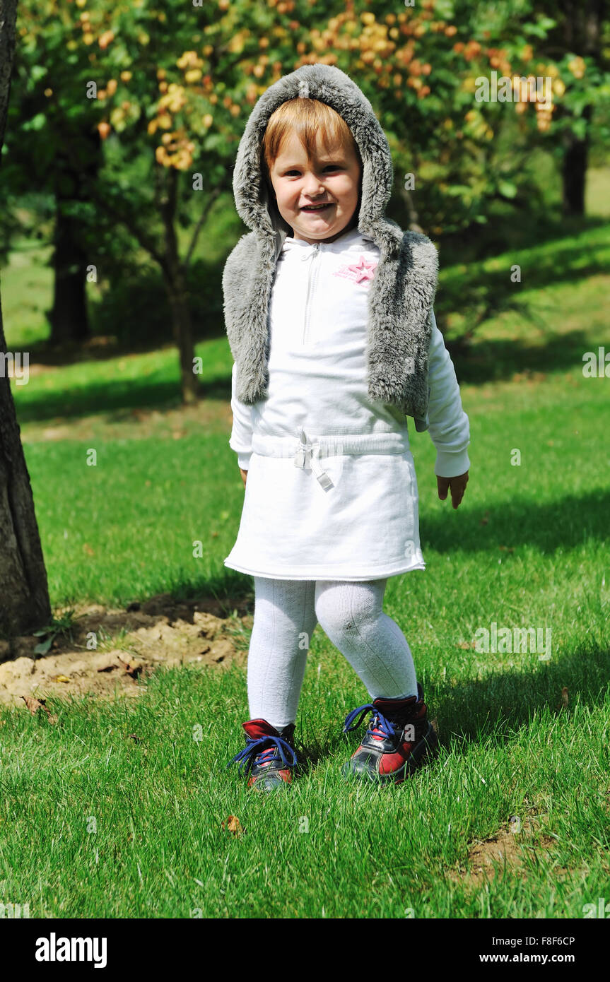 child fashion with beautiful little child outdoor in nature Stock Photo ...