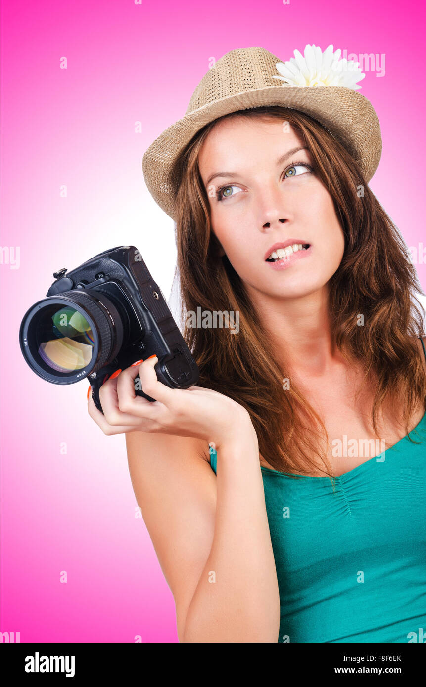 Attractive female photographer on white Stock Photo - Alamy