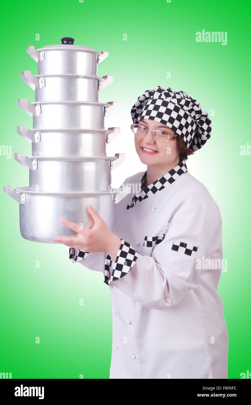 Cook with stack of pots on white Stock Photo - Alamy