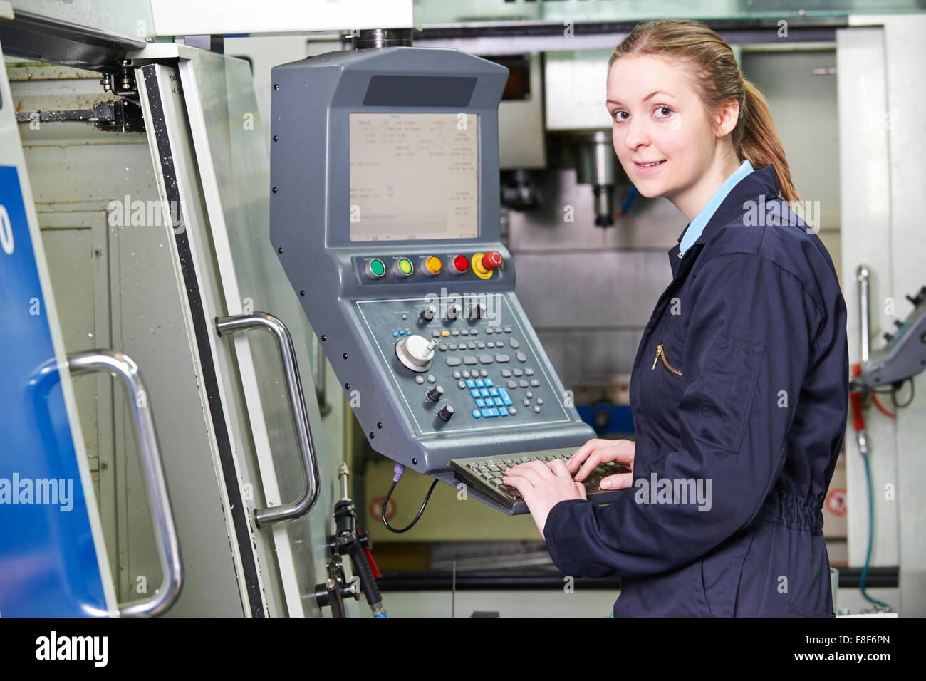 Female Engineer Operating Computer Controlled Cutting Machine Stock ...