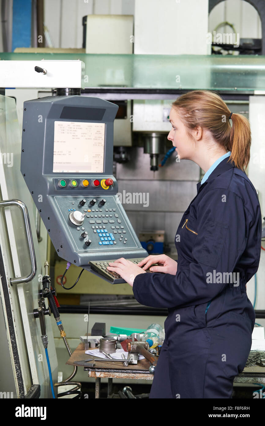 Female Engineer Operating Computer Controlled Cutting Machine Stock ...