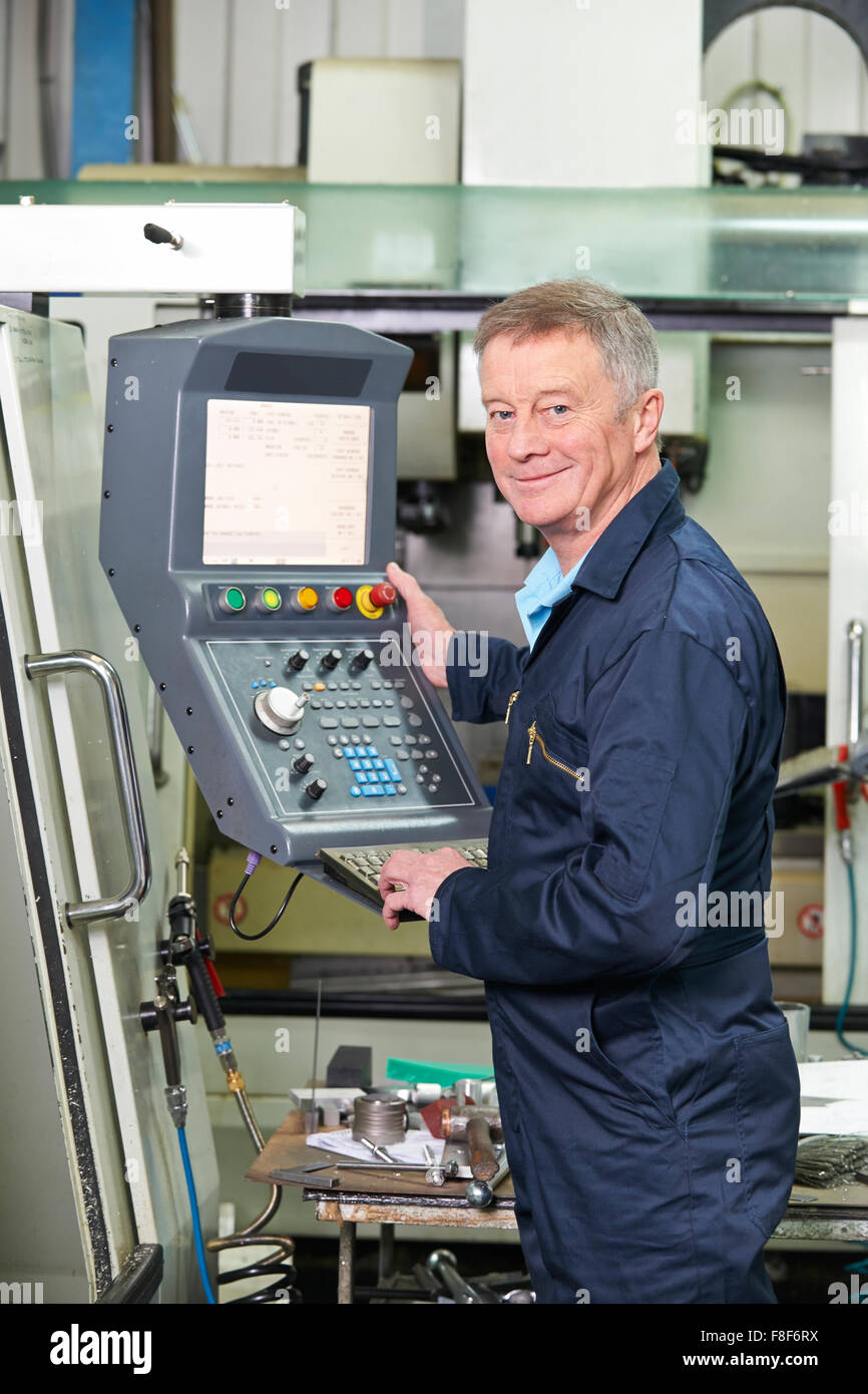 Engineer Operating Computer Controlled Cutting Machine Stock Photo - Alamy